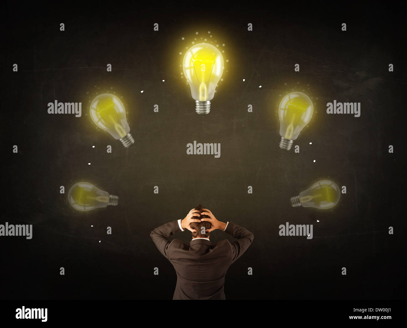Businessman with lightbulbs over his head Stock Photo - Alamy