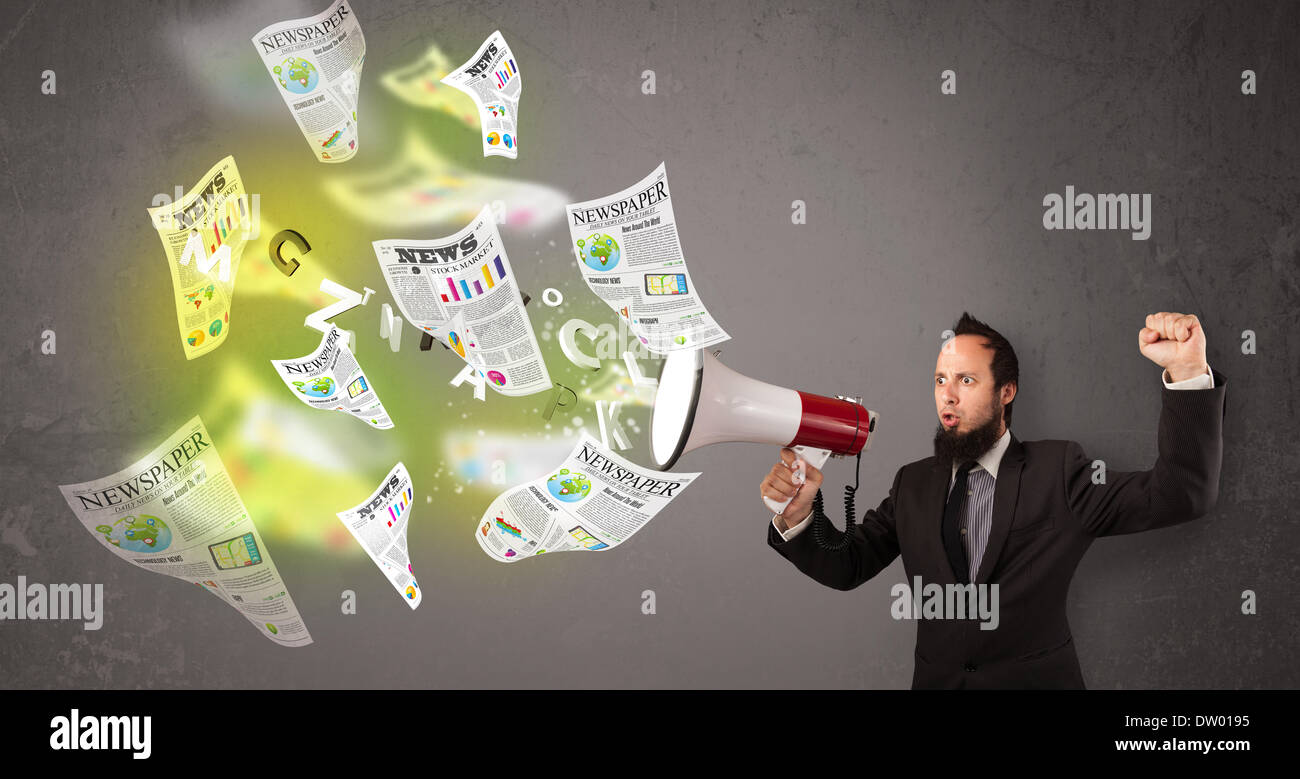 Guy yelling into loudspeaker and newspapers fly out Stock Photo - Alamy