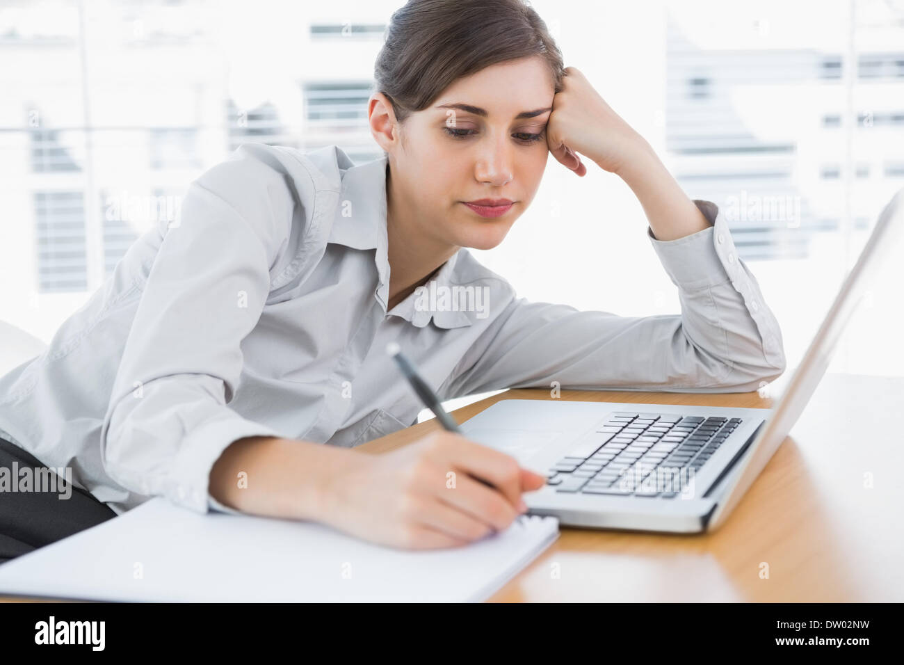 Slumped at desk hi-res stock photography and images - Alamy