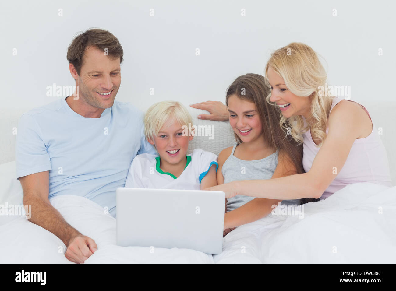 Family using a laptop Stock Photo - Alamy