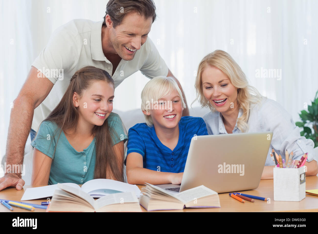 Clever child with parents hi-res stock photography and images - Alamy