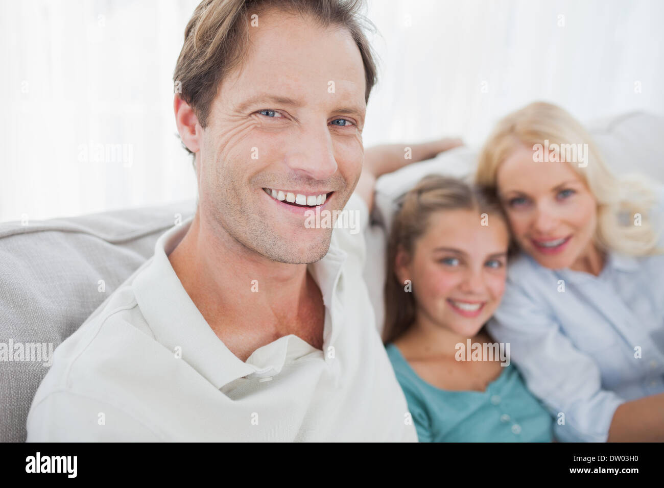 Portrait of a father with family behind Stock Photo - Alamy