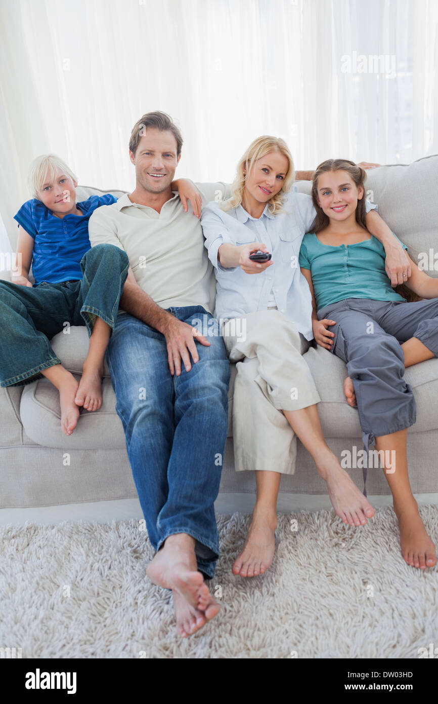 Portrait of a family watching television Stock Photo - Alamy