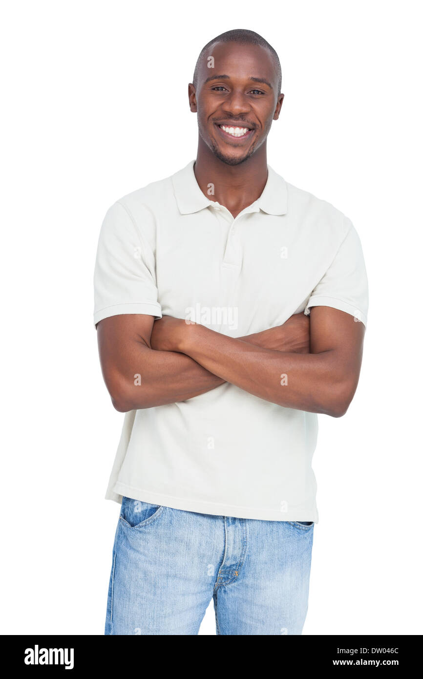 Smiling man posing with arms crossed Stock Photo - Alamy