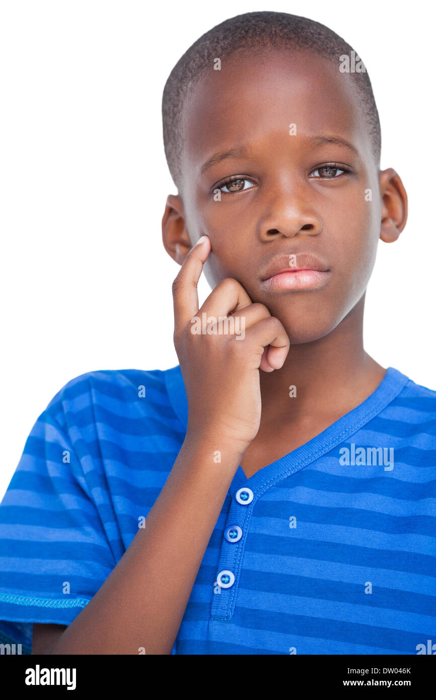 Thoughtful little boy with hand on face Stock Photo - Alamy