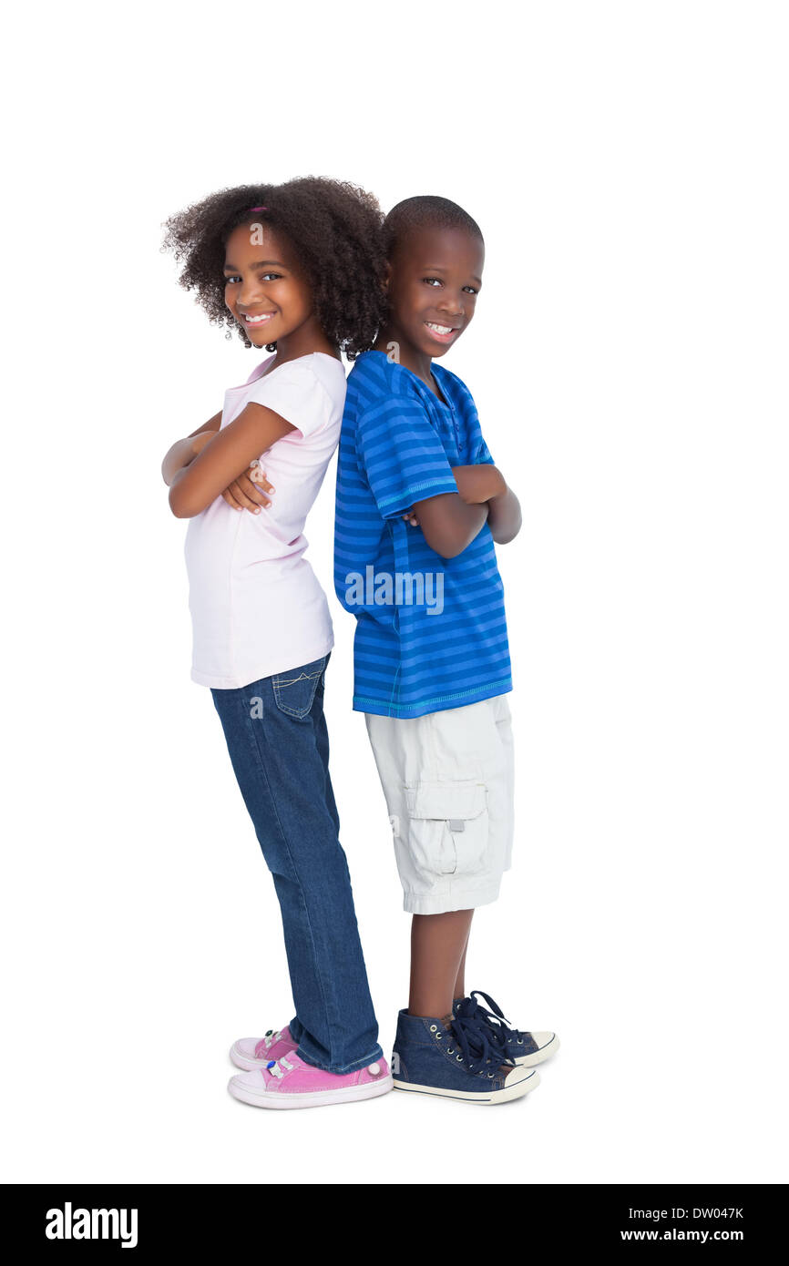 Brother and sister back to back Stock Photo - Alamy