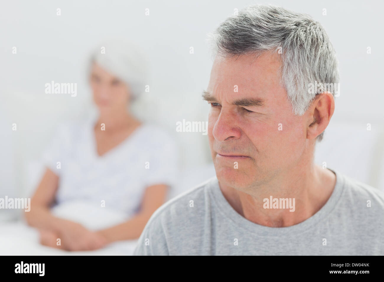 Man sulking in bed during a conflict Stock Photo - Alamy