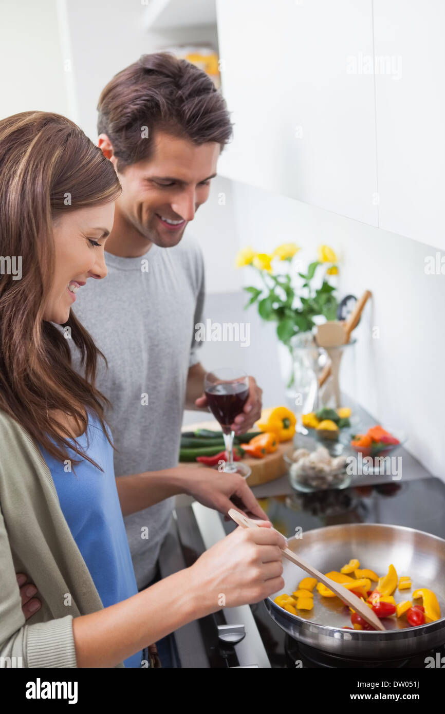 Couple cooking together vegetables Stock Photo - Alamy