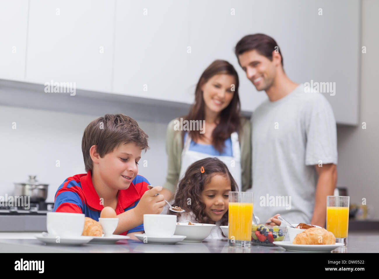 Children having breakfast in kitchen Stock Photo - Alamy