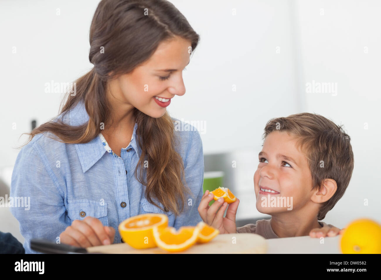 Boy eating orange hi-res stock photography and images - Alamy