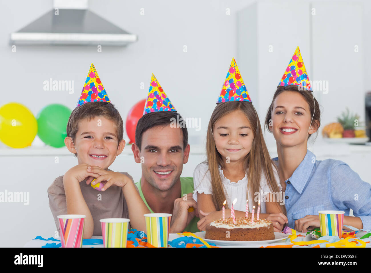 Parents celebrating their daughter birthday Stock Photo - Alamy