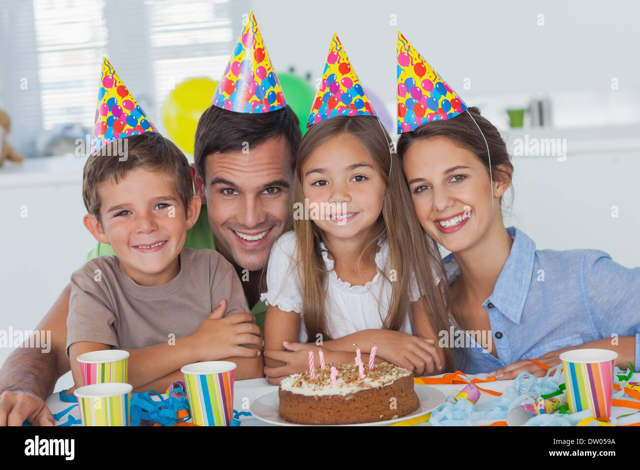 Beautiful family celebrating a party Stock Photo - Alamy