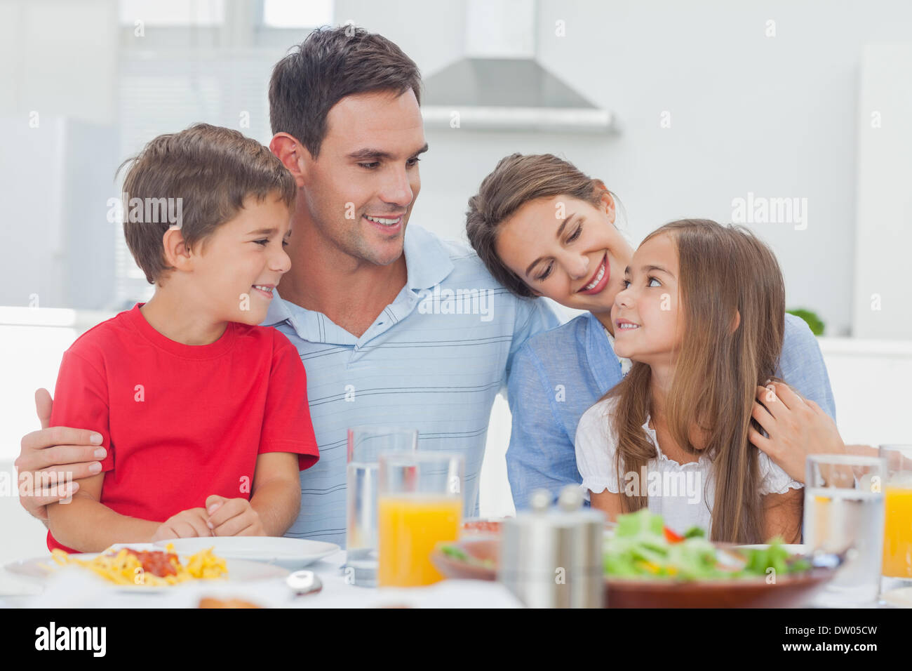 Cute family during the dinner Stock Photo - Alamy