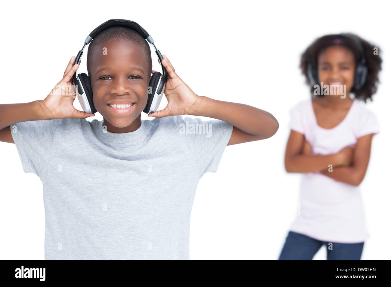 Brother and sister listening to music Stock Photo - Alamy