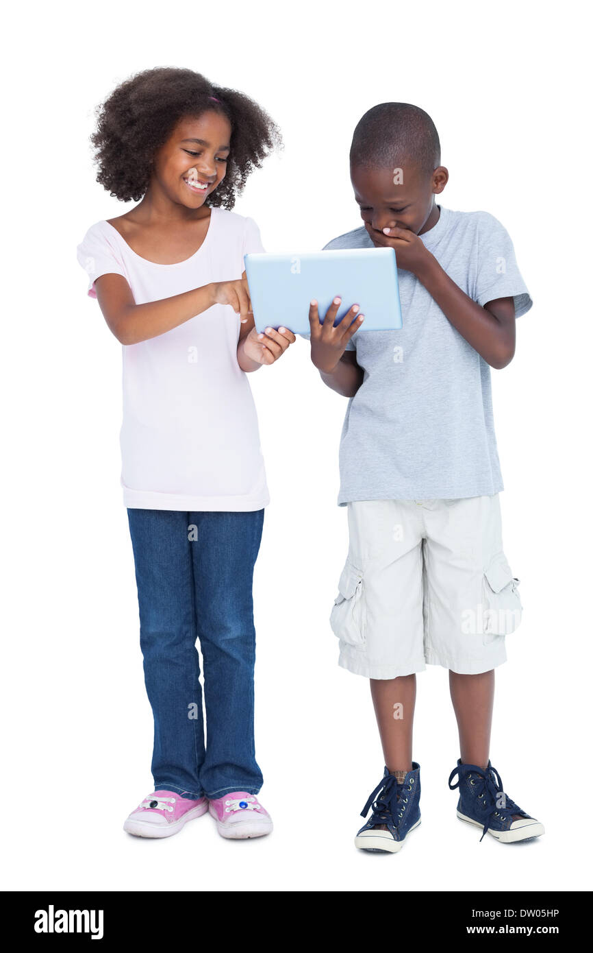 Laughing boy looking at tablet pc Stock Photo - Alamy