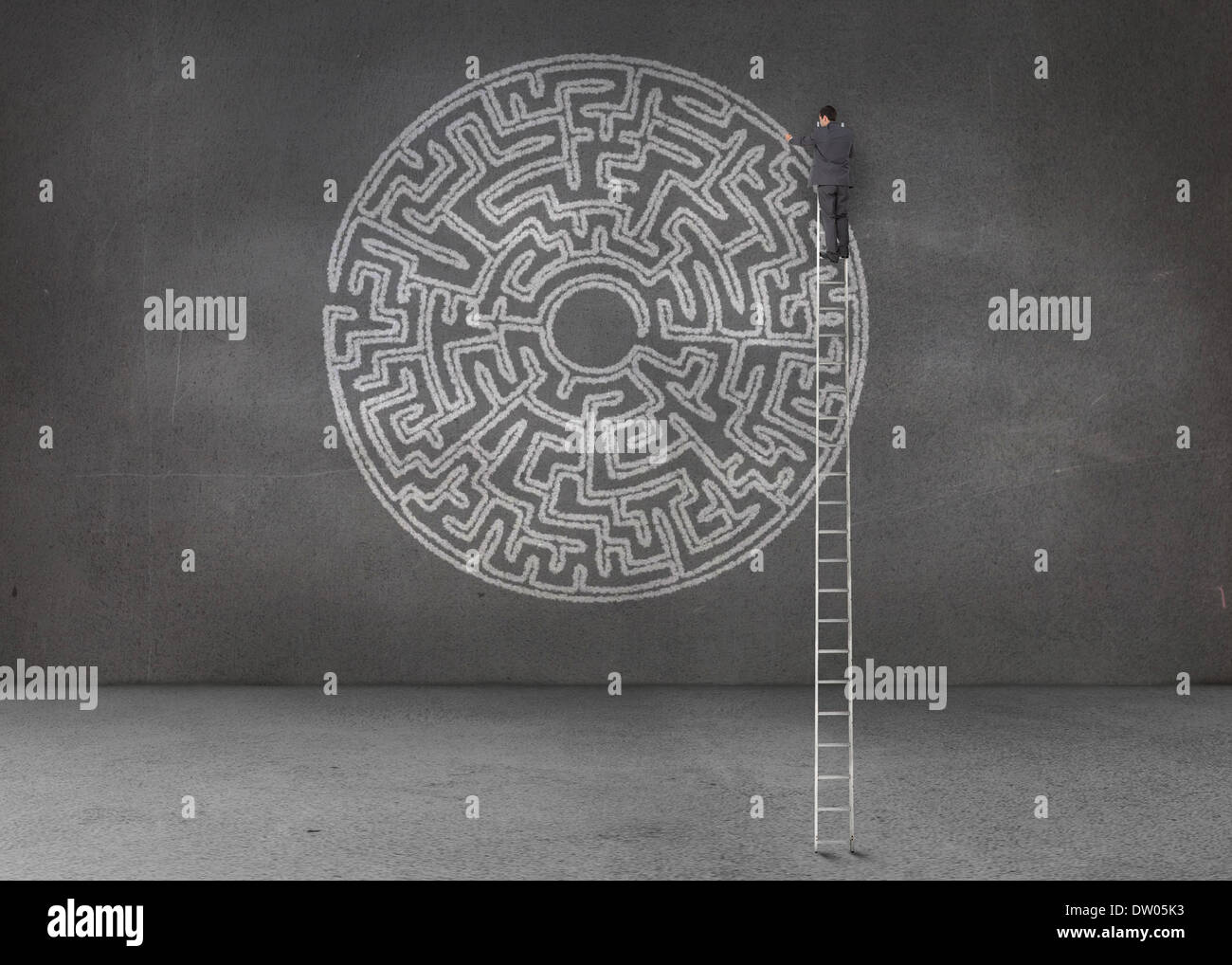 Businessman drawing a labyrinth Stock Photo - Alamy