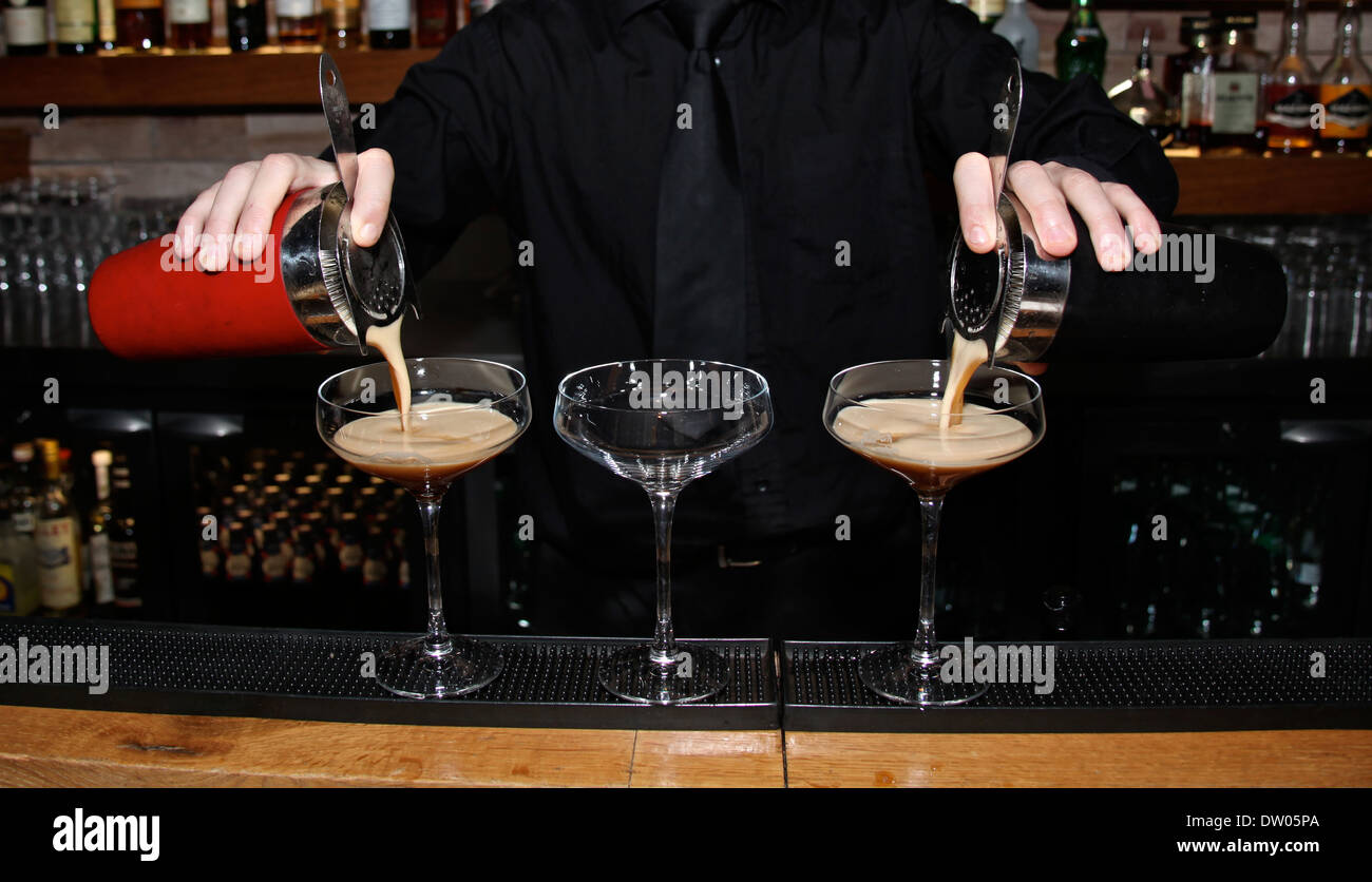 bartender mixing cocktails at the bar Stock Photo - Alamy