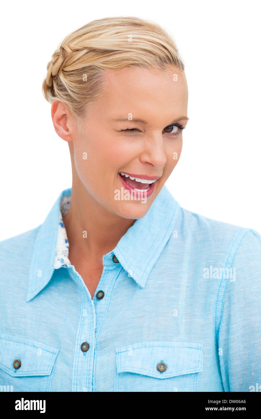 Blonde woman winking Stock Photo - Alamy