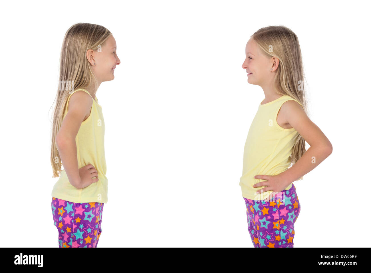 Smiling sisters standing together hi-res stock photography and images ...