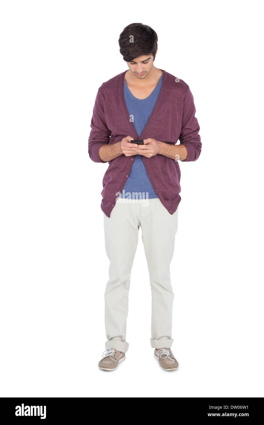 Young man using his mobile phone Stock Photo - Alamy