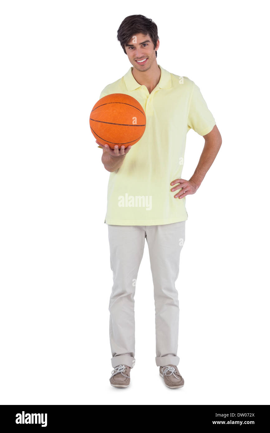 Hip young man holding basketball hi-res stock photography and images ...