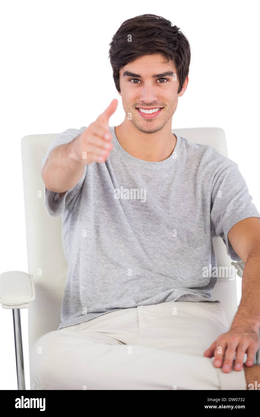 Young man ready to shake hand Stock Photo - Alamy