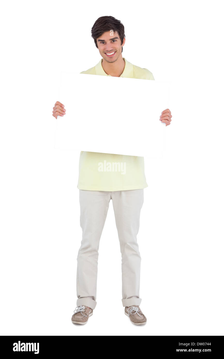 Smiling man holding empty sign Stock Photo - Alamy