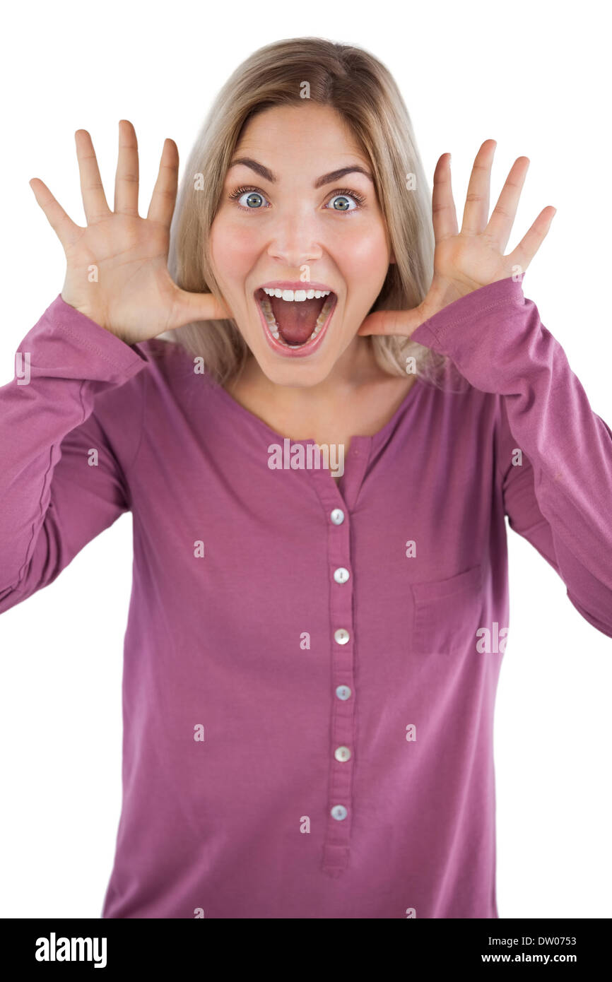 Surprised young woman raising hands Stock Photo - Alamy