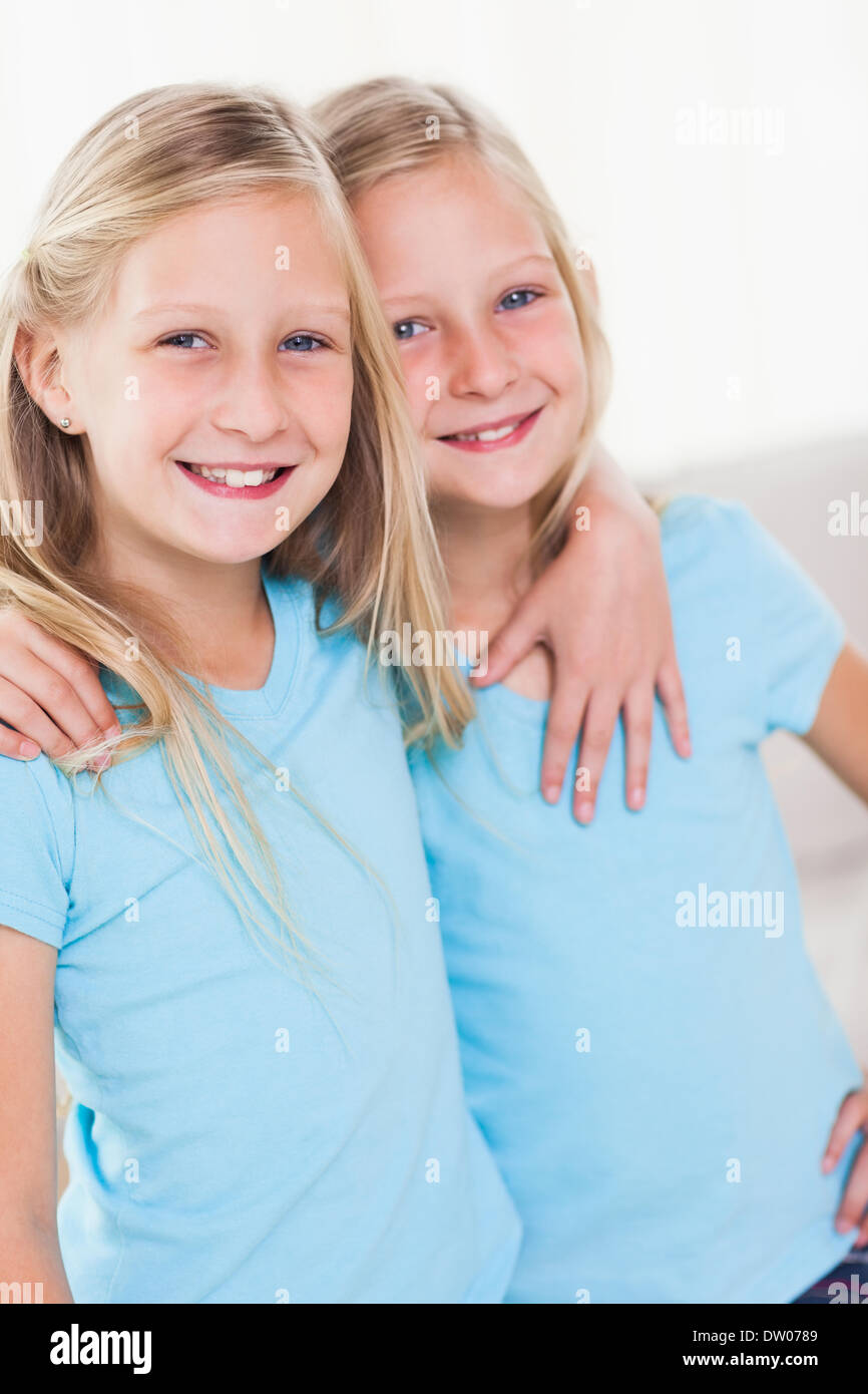 Cute twins embracing each other Stock Photo - Alamy