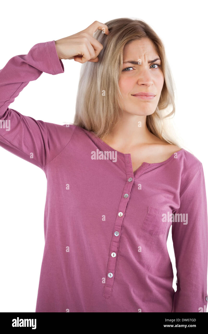 Young woman scratching head Stock Photo - Alamy
