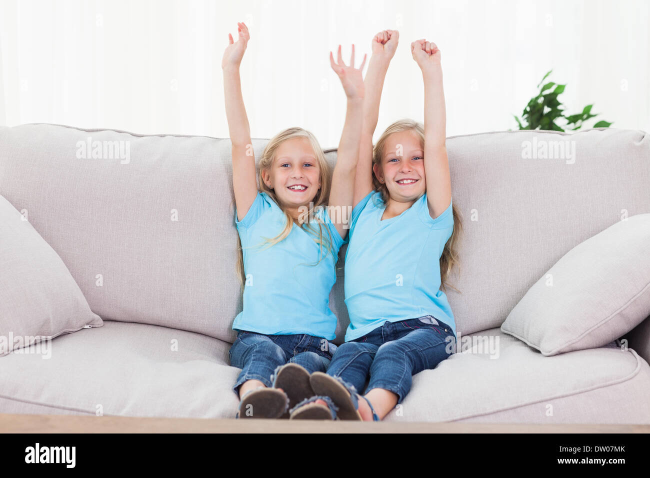 Child raising arms and cheering hi-res stock photography and images - Alamy