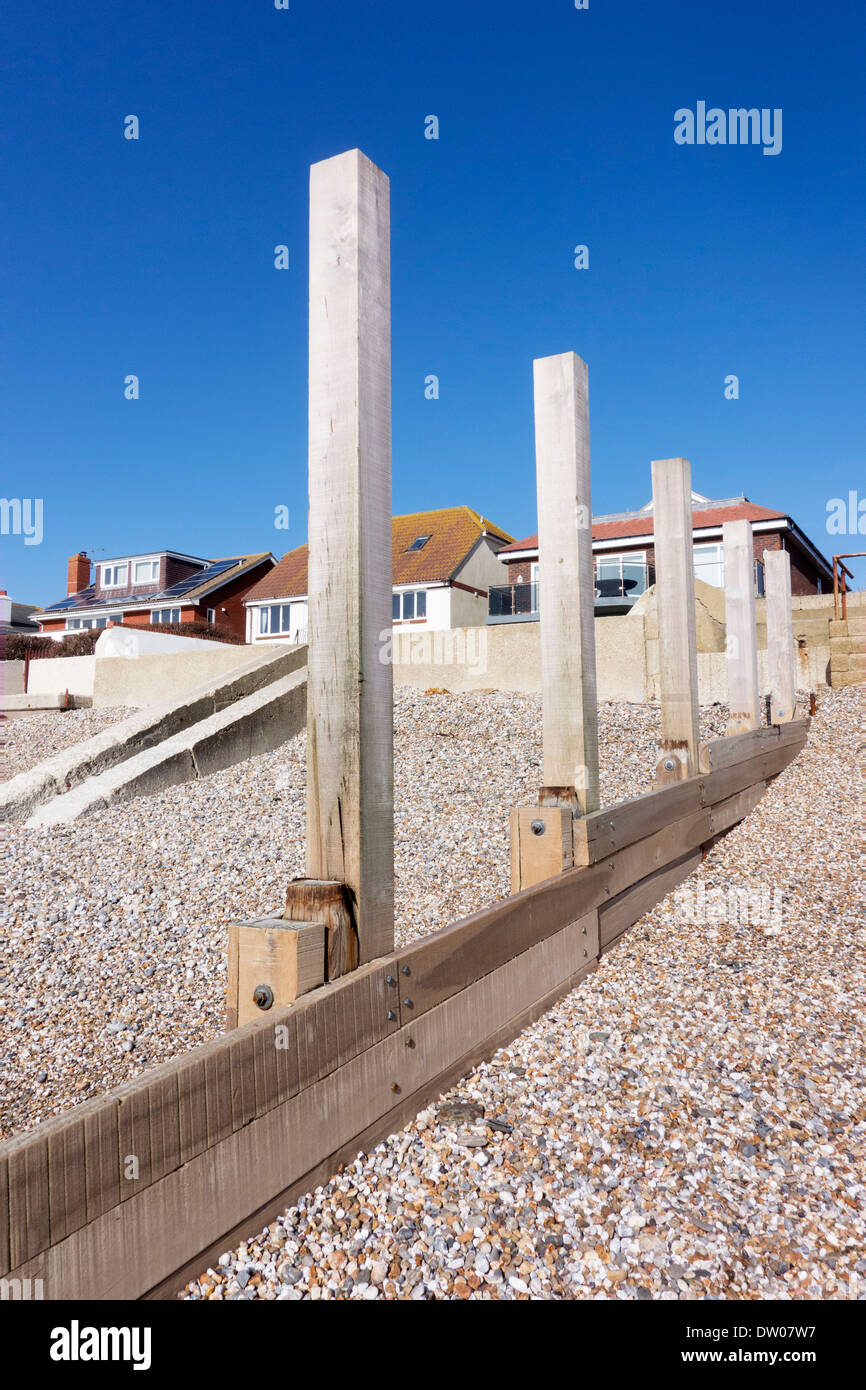 England, West Sussex, West Wittering. Newly installed timber groynes ...