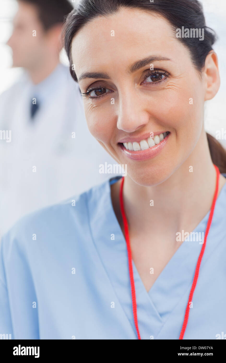 Cheerful nurse smiling at camera Stock Photo - Alamy