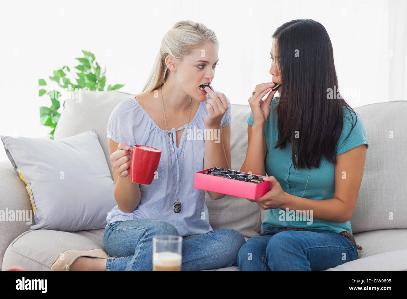 Friends sharing chocolates hi-res stock photography and images - Alamy