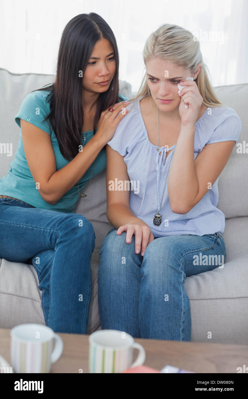 Asian friend crying friend comforting hi-res stock photography and ...