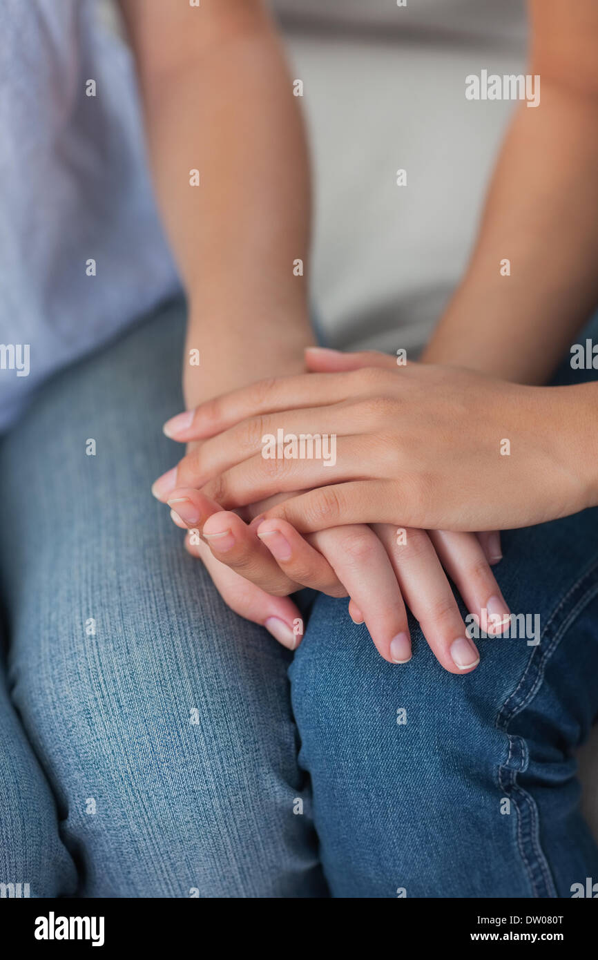 Close friends holding hands Stock Photo - Alamy
