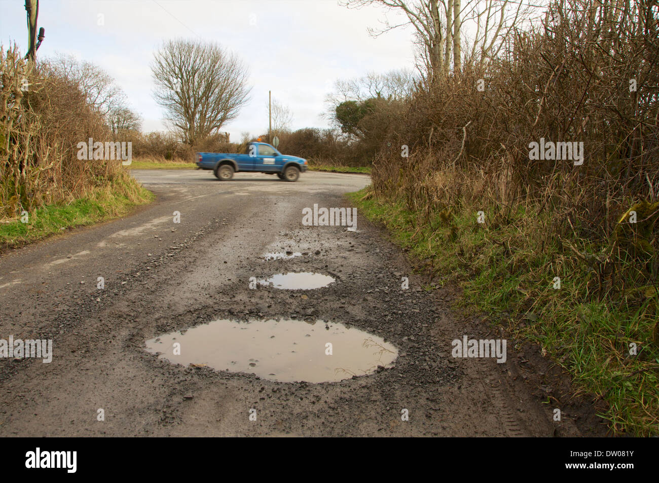 Potholes on a country road in rural County Mayo, Ireland Stock Photo ...