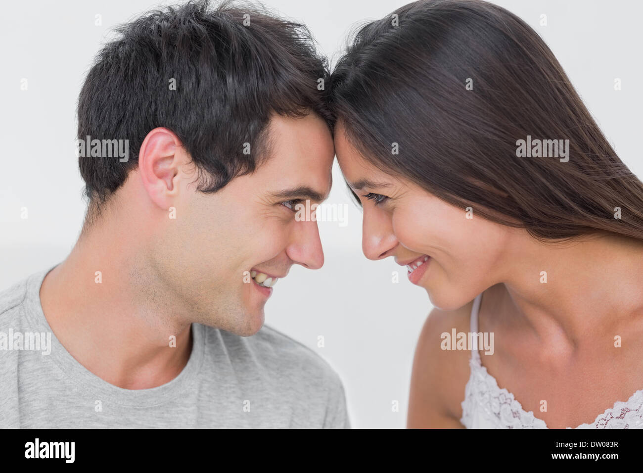 Couple facing each other Stock Photo - Alamy