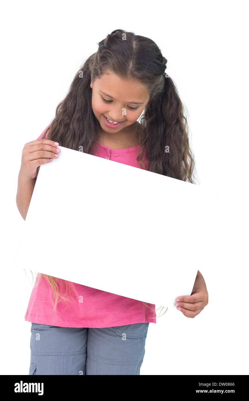 Little girl holding and looking at sign Stock Photo - Alamy