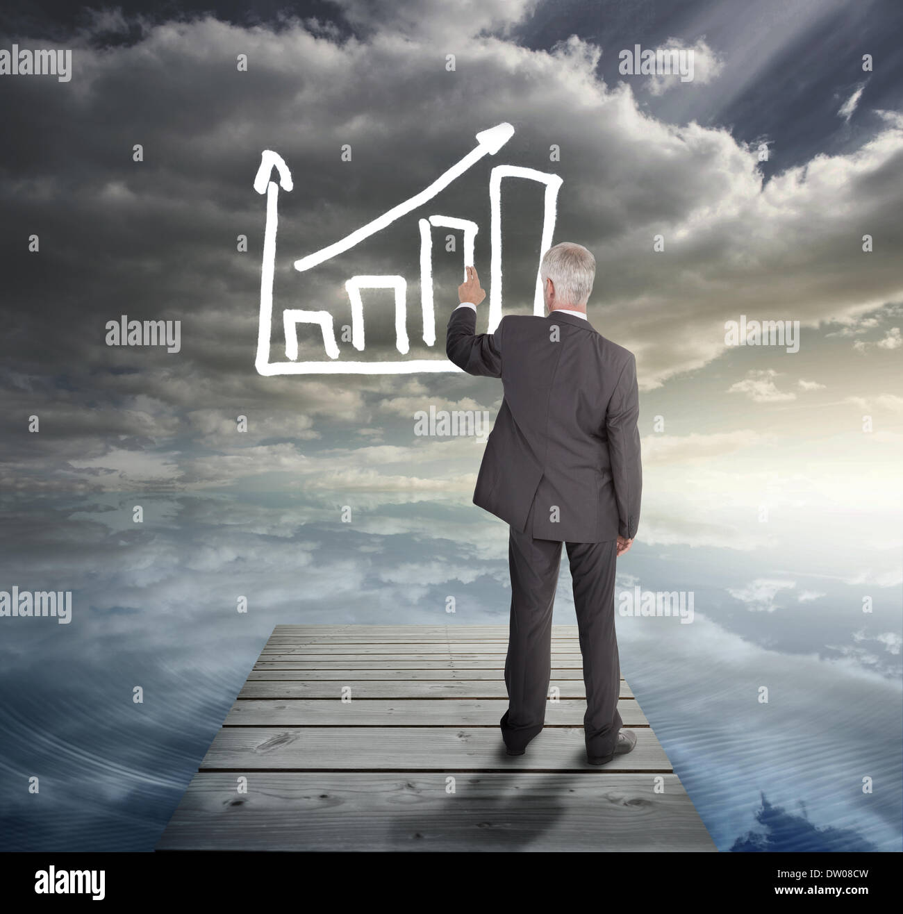 Elegant businessman drawing a bar chart Stock Photo - Alamy