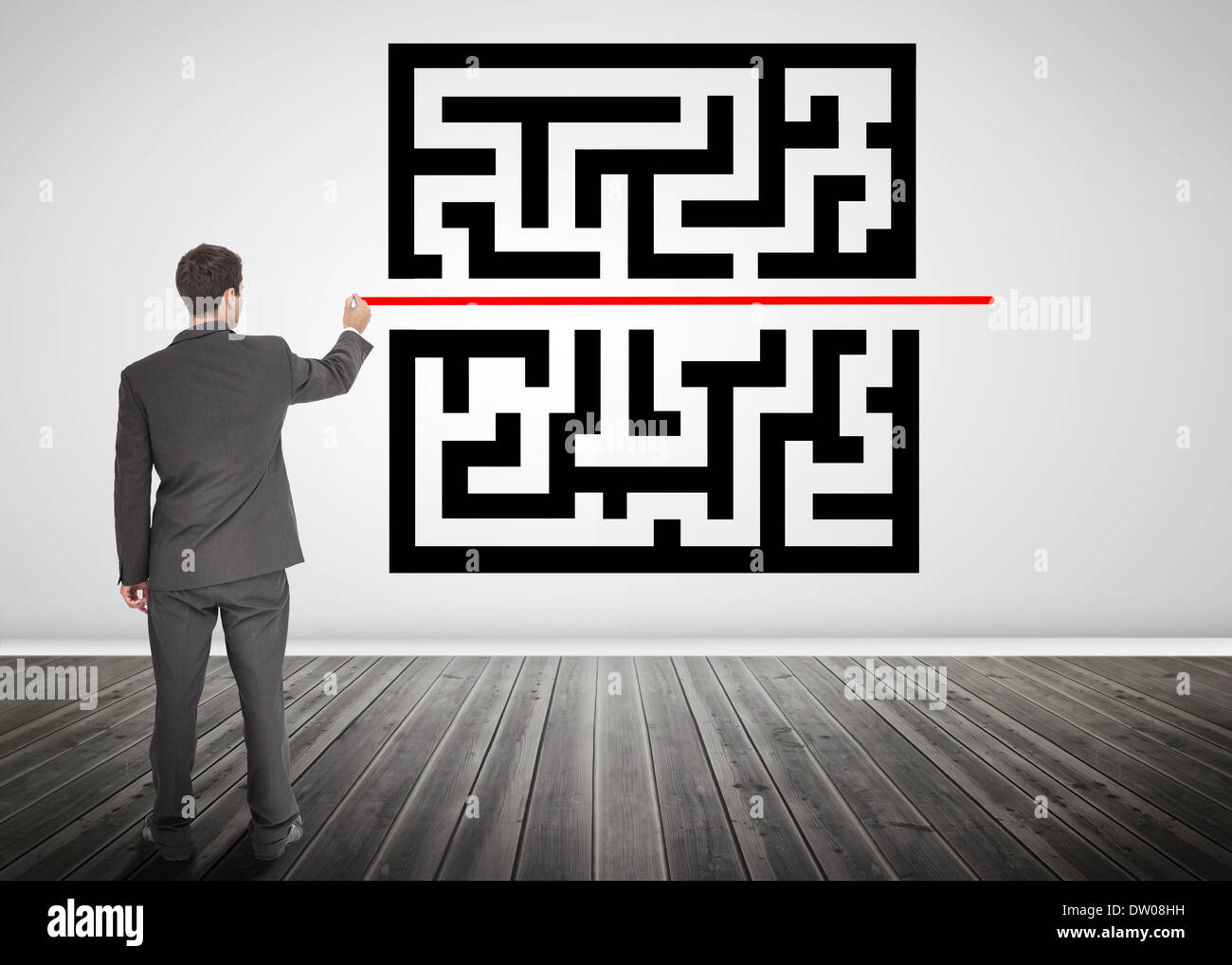 Businessman drawing a line through qr code Stock Photo - Alamy