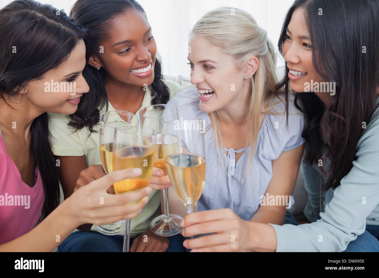 Asian friends toasting wine hi-res stock photography and images - Alamy