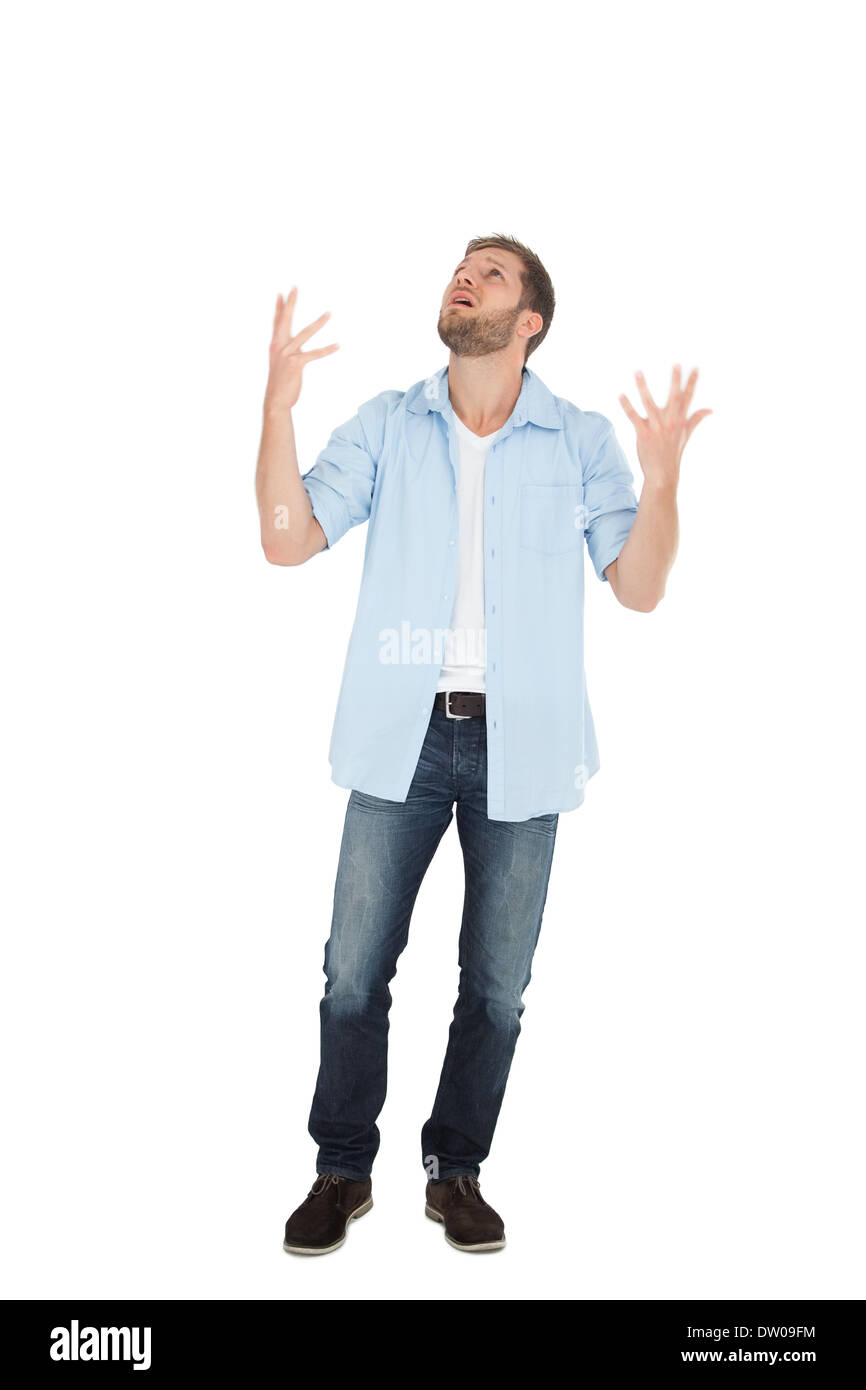 Casual man with hands up Stock Photo - Alamy
