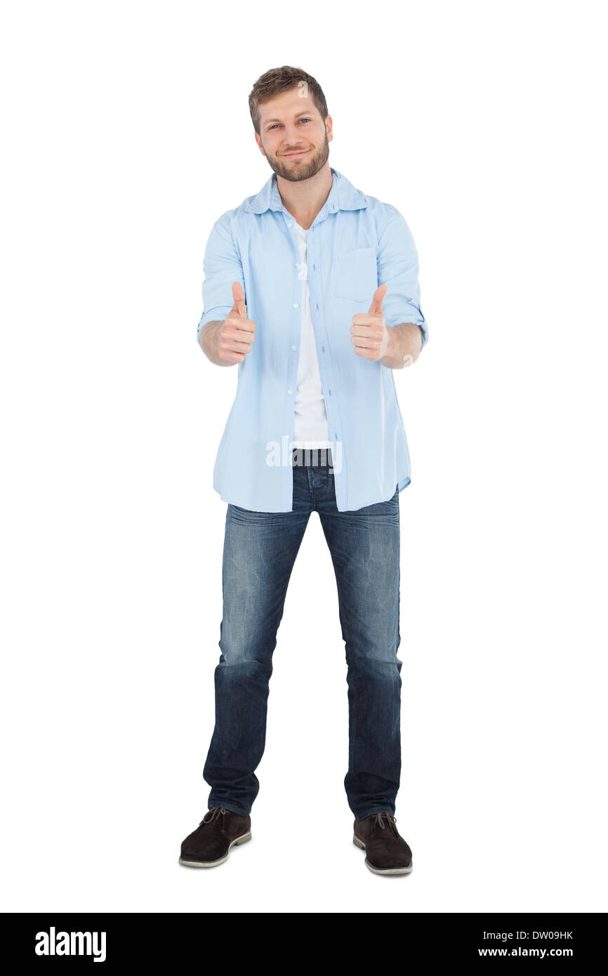 Confident model giving thumbs up to camera Stock Photo - Alamy