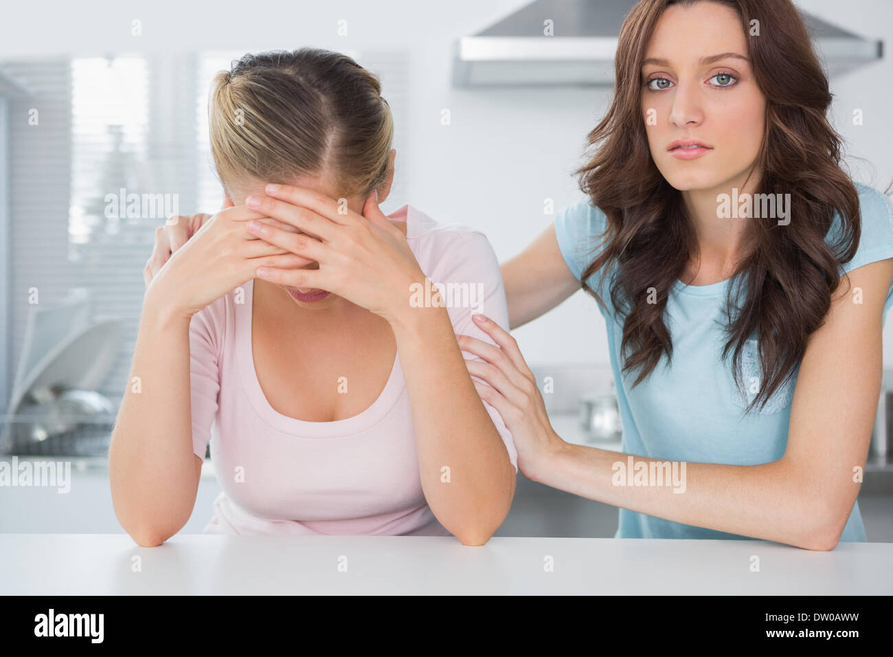 Friend comforting crying woman hi-res stock photography and images - Alamy