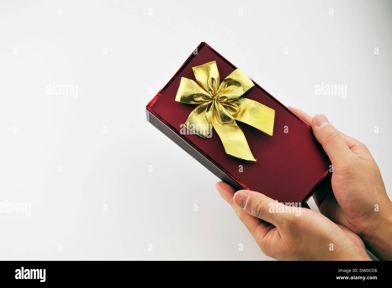 Gift box wrapped with ribbon Stock Photo - Alamy