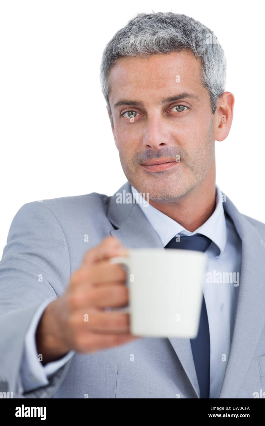 Business man offering cup hi-res stock photography and images - Alamy