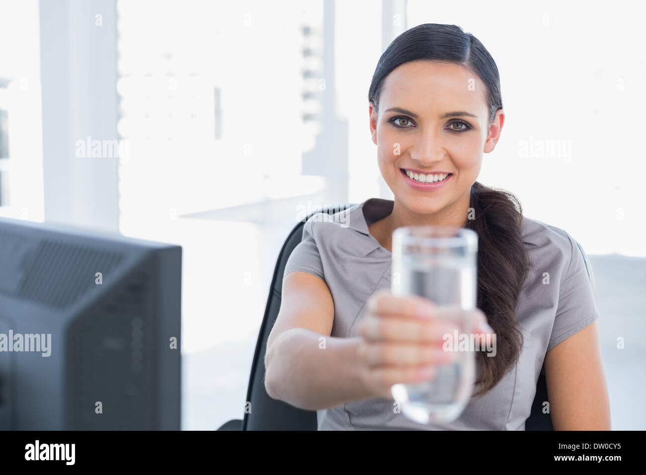Young woman offering glass water hi-res stock photography and images ...