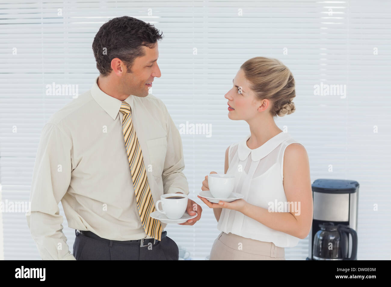 Stylish workmates having coffee together Stock Photo - Alamy