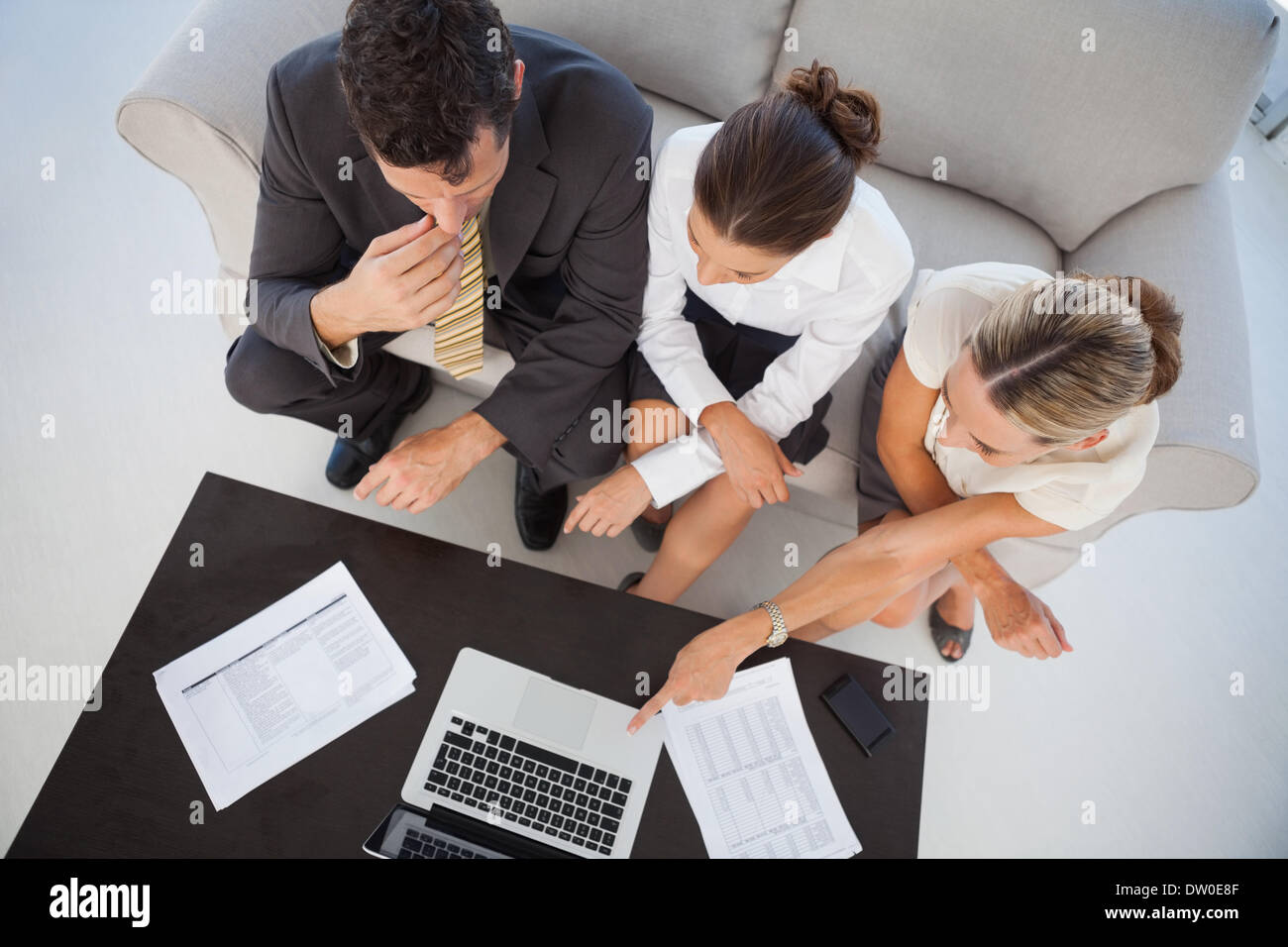 Overhead view of colleagues working together Stock Photo - Alamy